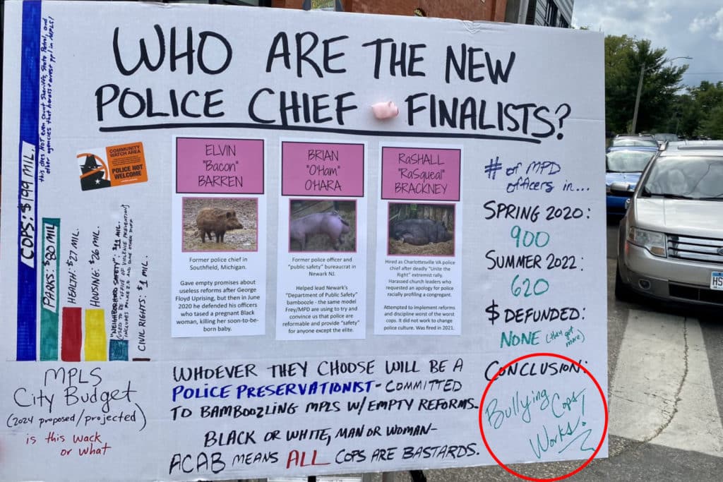 Activists display 'bullying cops works' sign at Minneapolis event ...