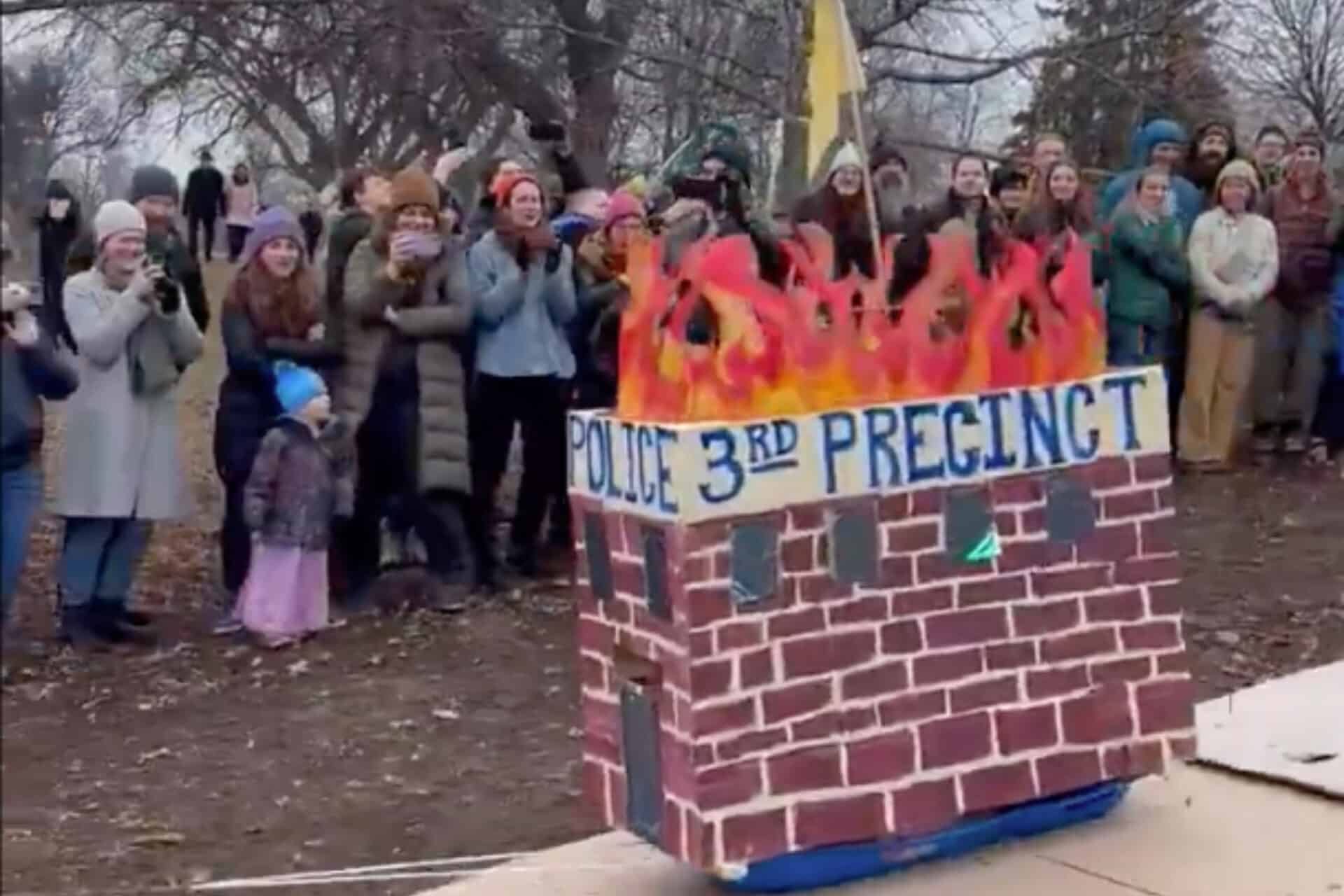 Minneapolis residents cheer on replica of burning Third Precinct ...